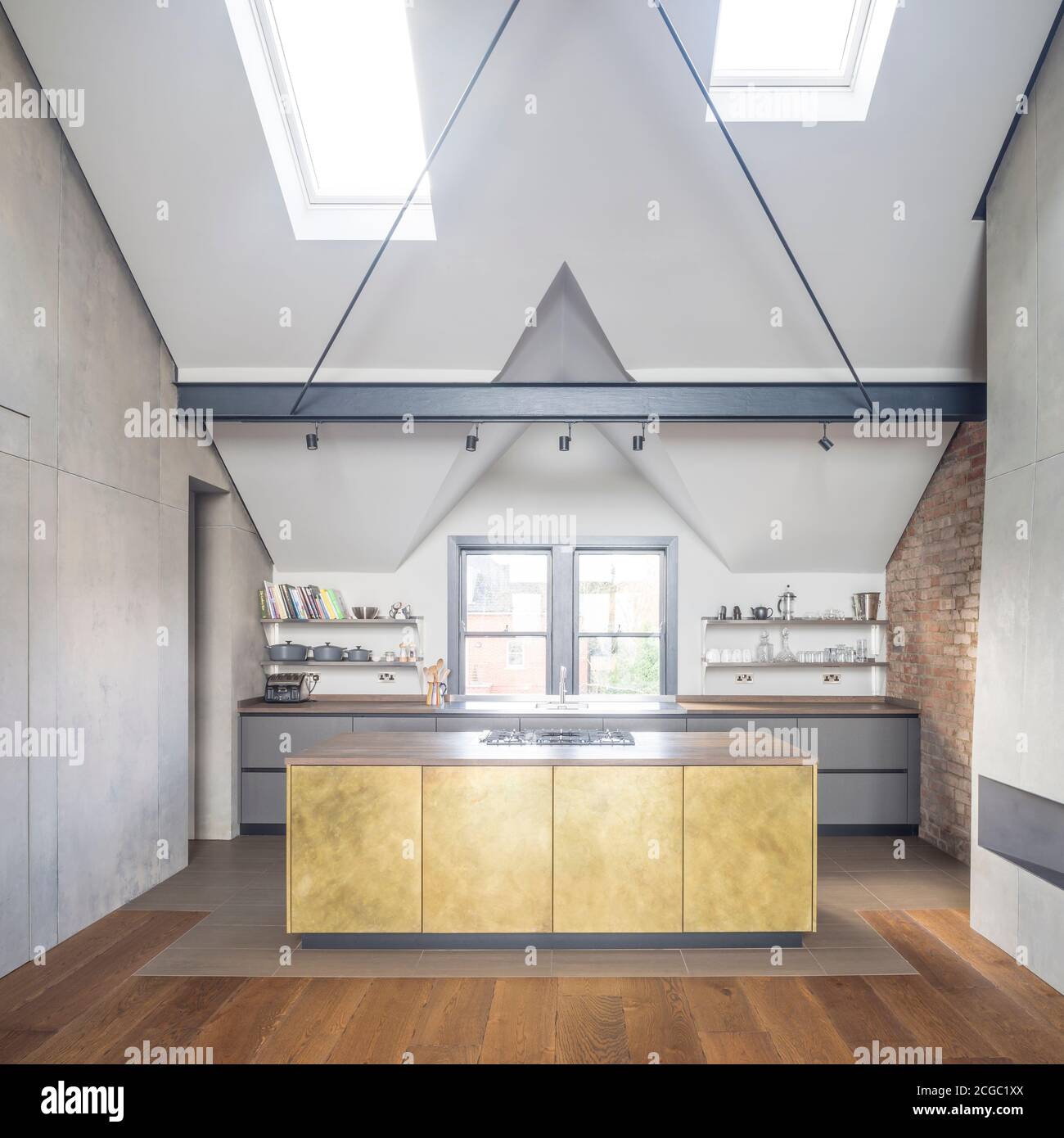 Bespoke brass kitchen of a refurbished top floor flat of a large detached Victorian property and ...