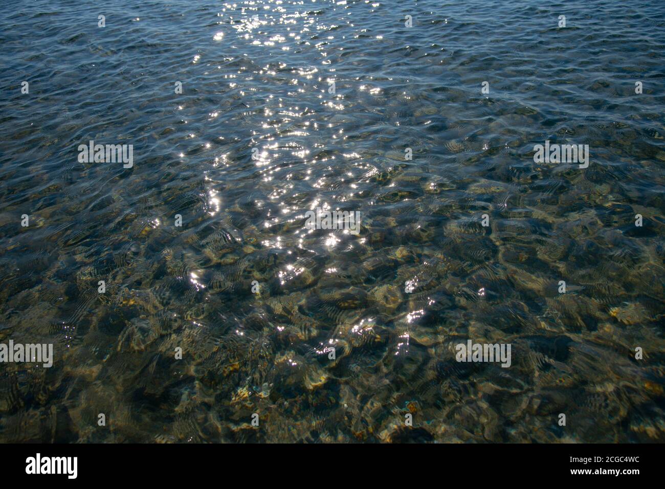 Full frame transparent sea water, illuminated by the sun Stock Photo ...