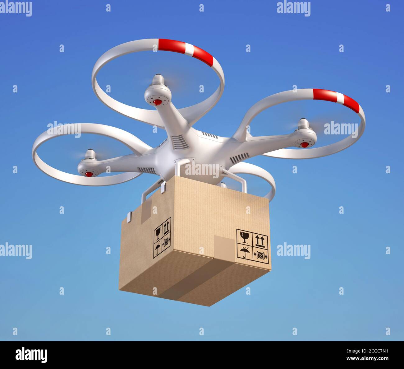 Drone with cardboard box in the sky Stock Photo - Alamy