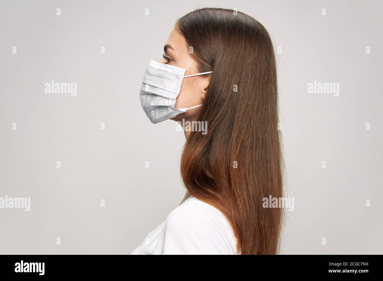 Girl Medical face mask side view cropped view safety Stock Photo - Alamy
