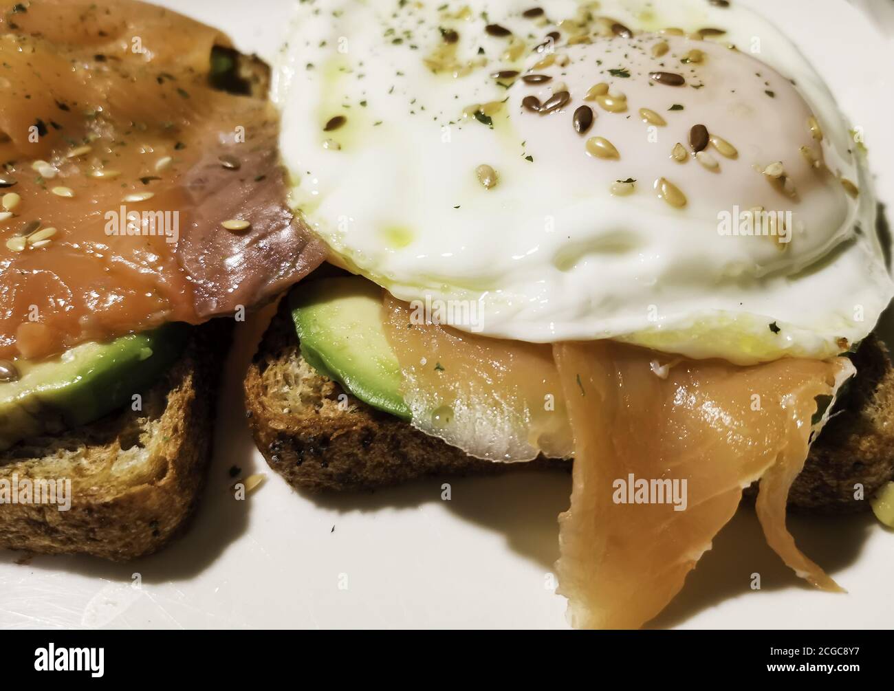 Egg toast with avocado and seeds, healthy food and omega Stock Photo ...
