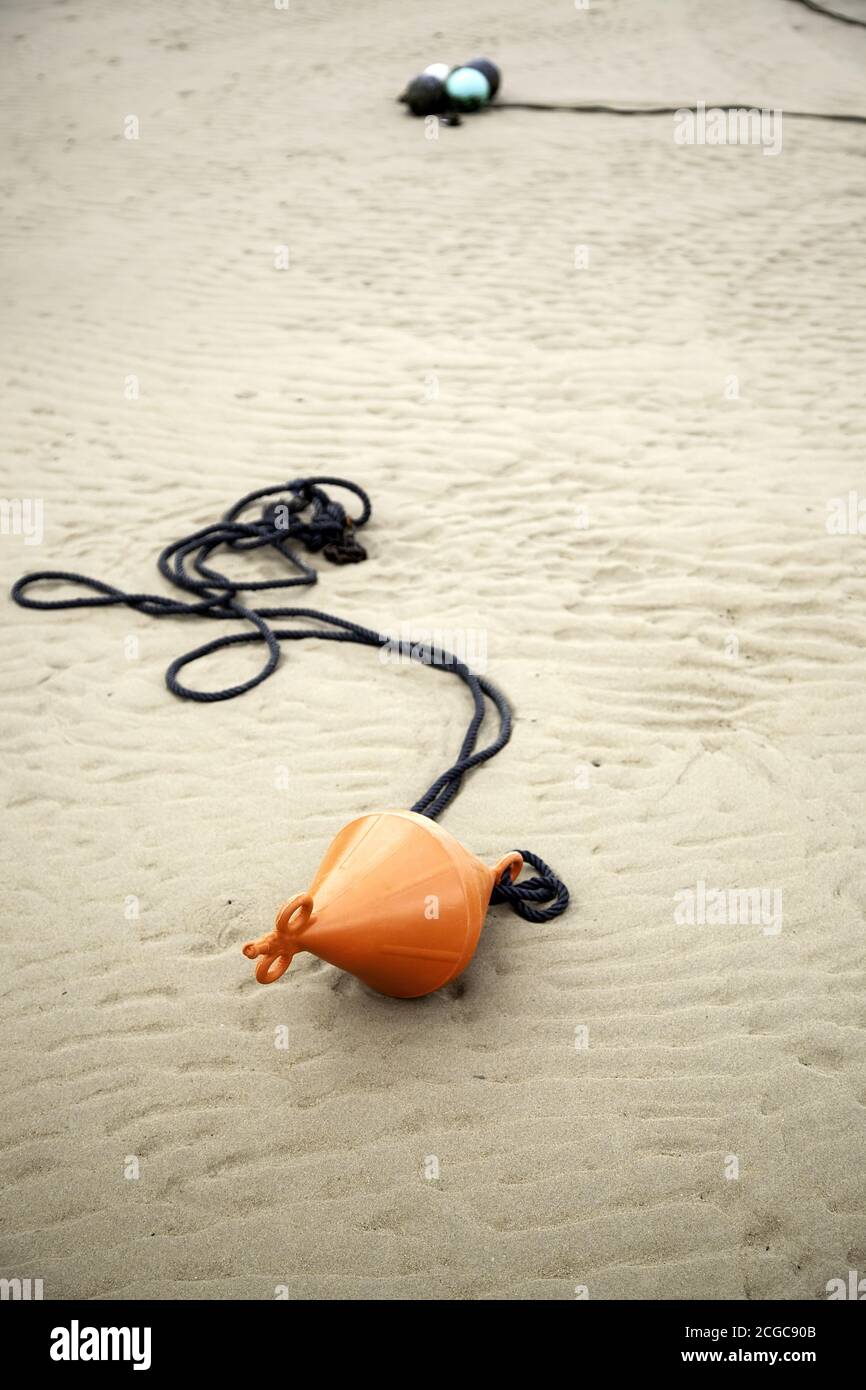 Buoy on sand beach, tourist landscape, sea and nature Stock Photo - Alamy