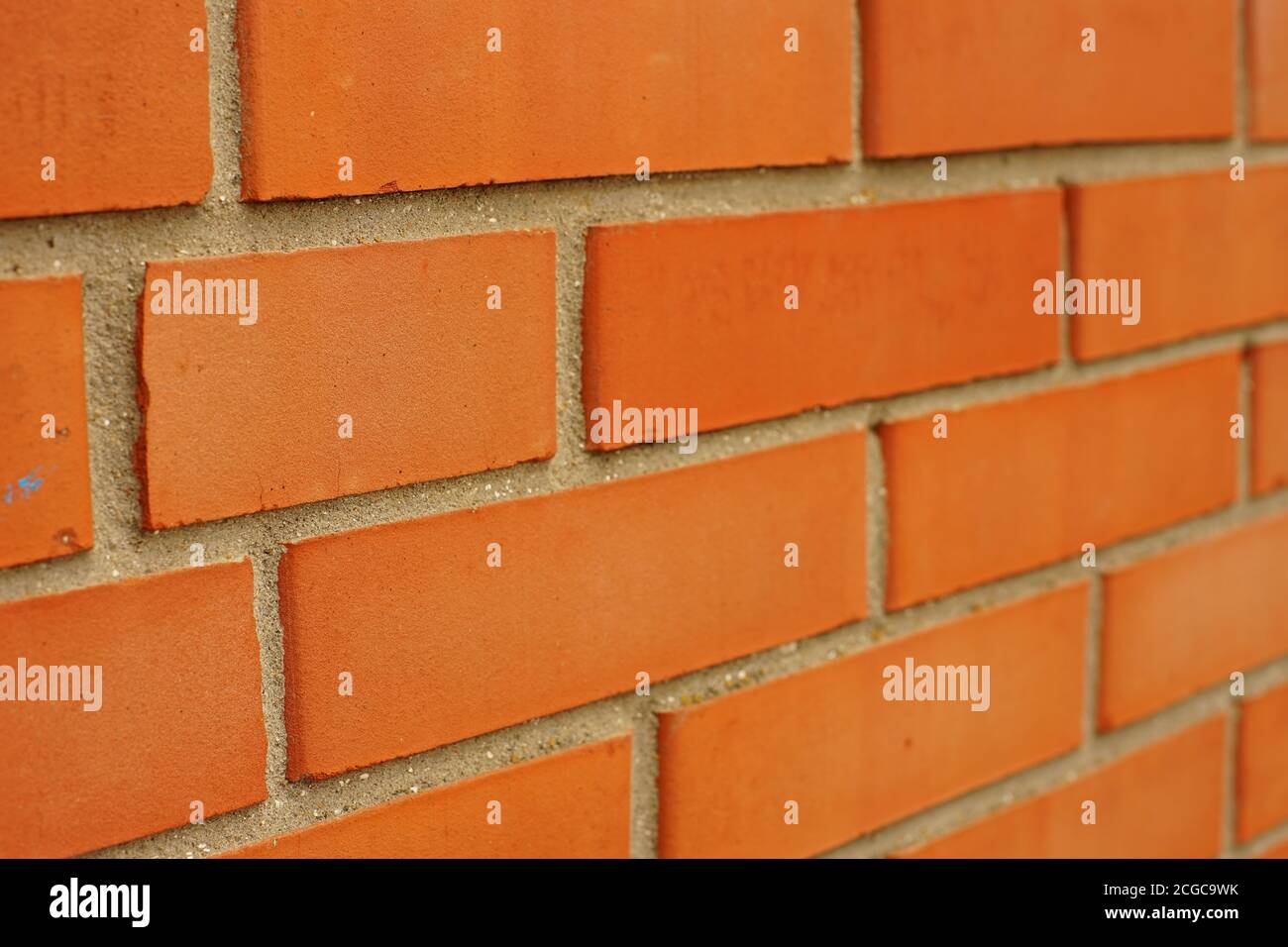 Orange brick wall. Perspective close up view Stock Photo - Alamy