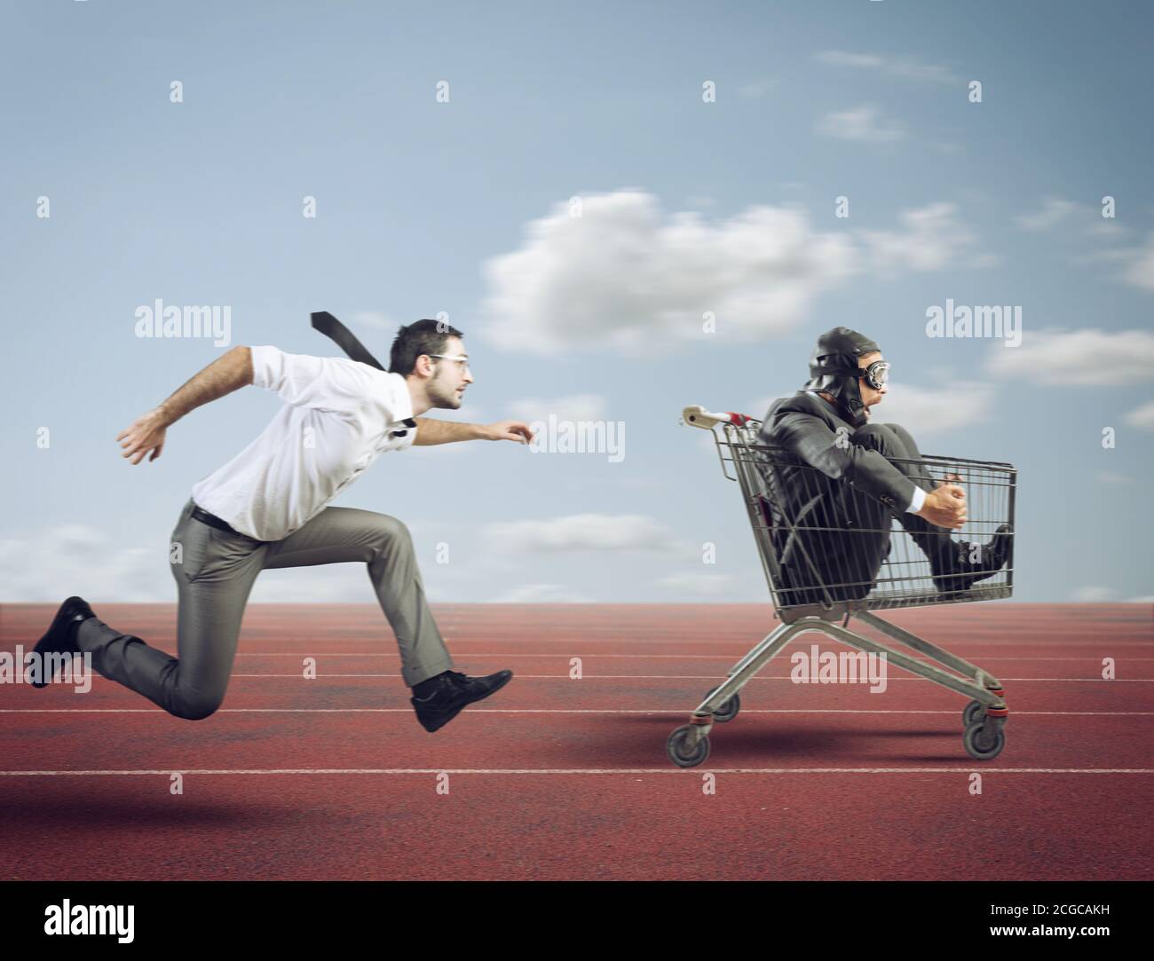 Businessman runs fast driving a cart during a competition Stock Photo ...