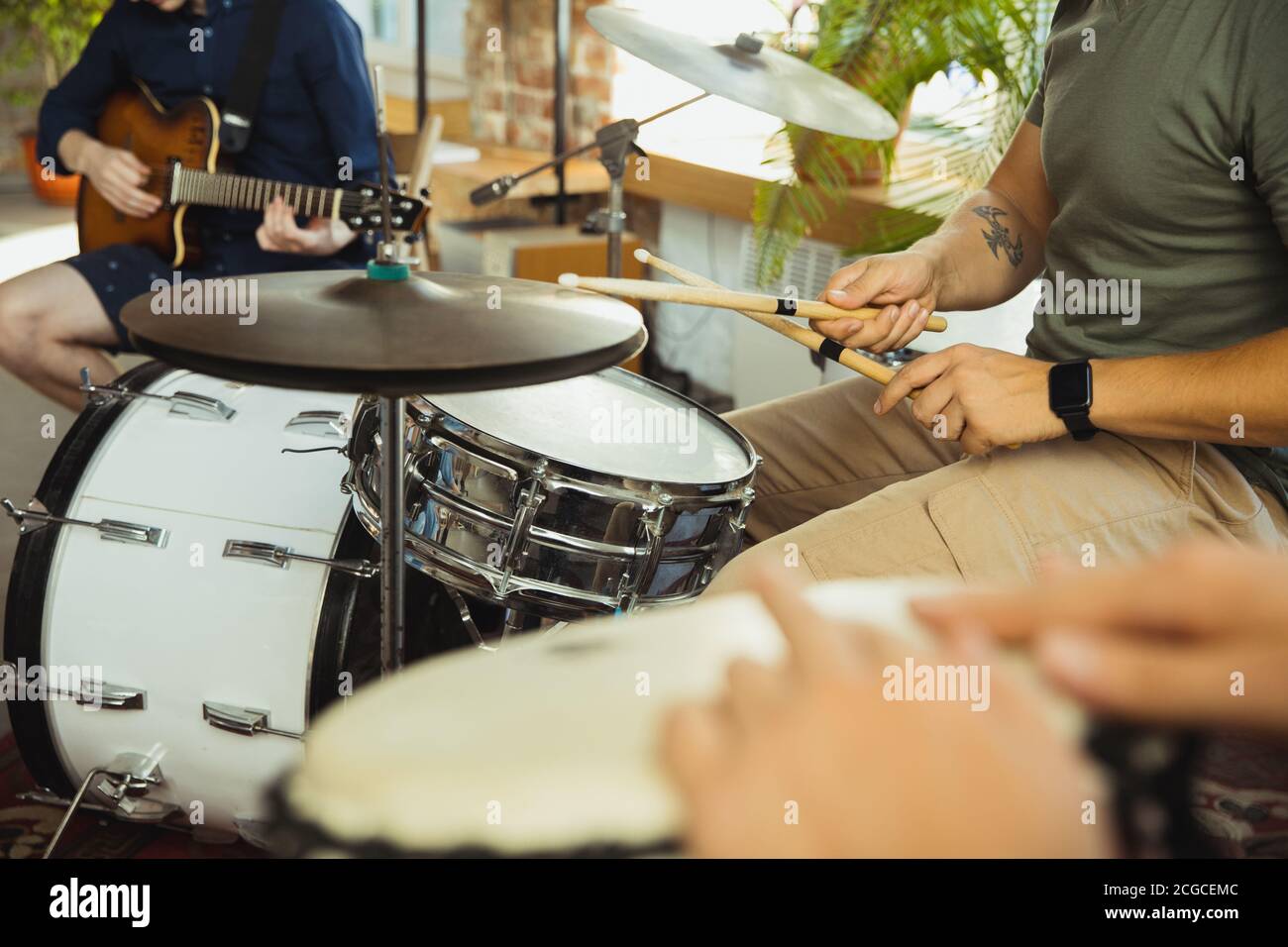 Festival. Musician band jamming together in art workplace with ...