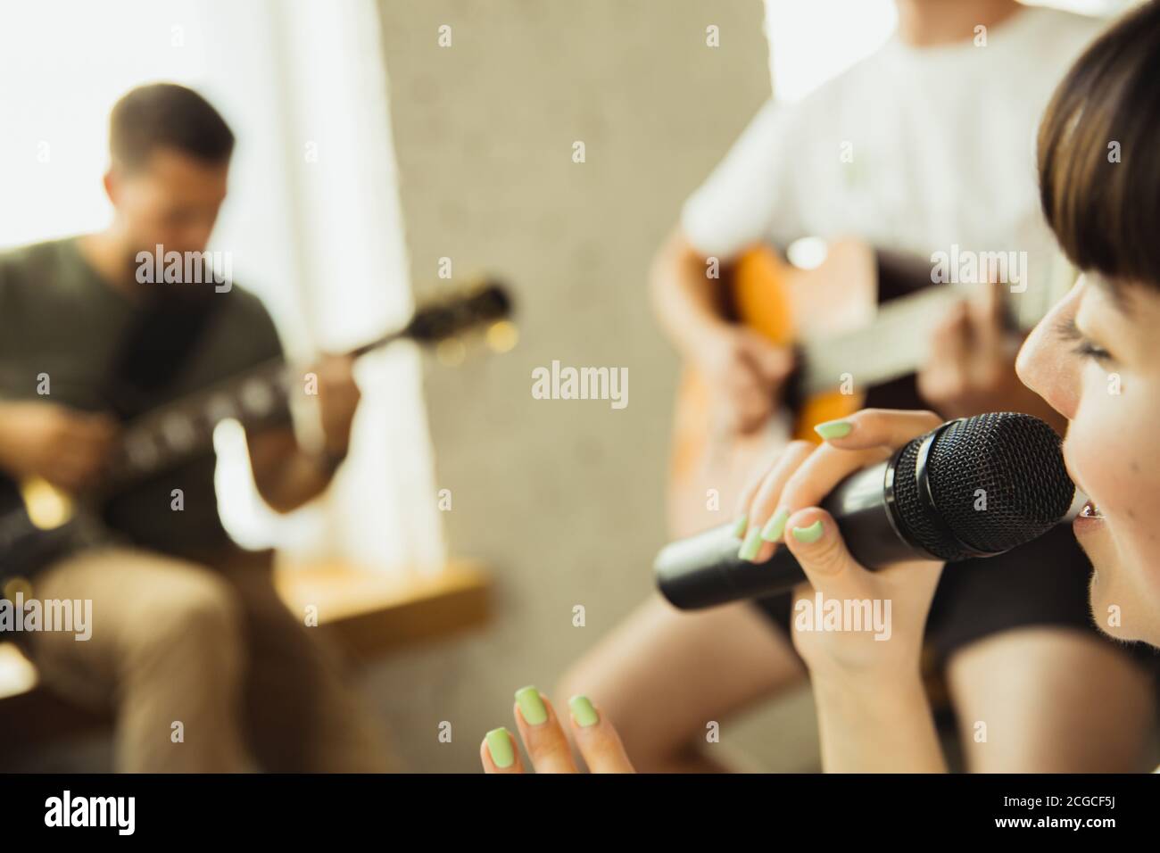 Festival. Musician band jamming together in art workplace with ...