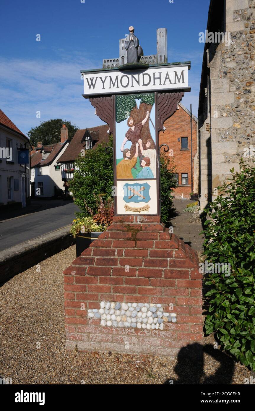Town sign, Wymondham, Norfolk. One side depicts Robert Kett, and a wood ...