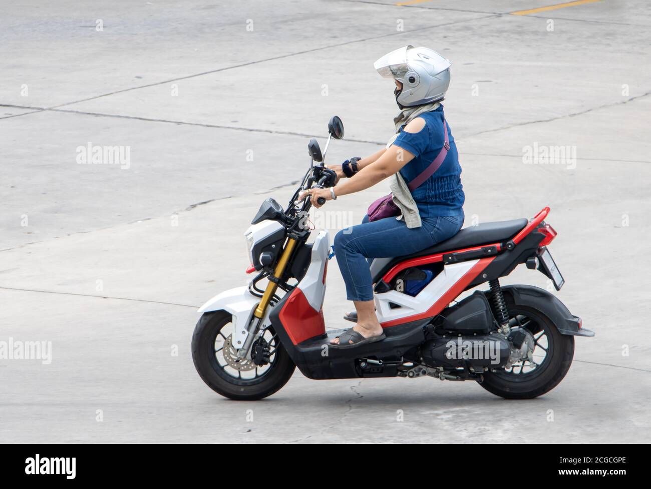 Moped rider on the way hi-res stock photography and images - Alamy