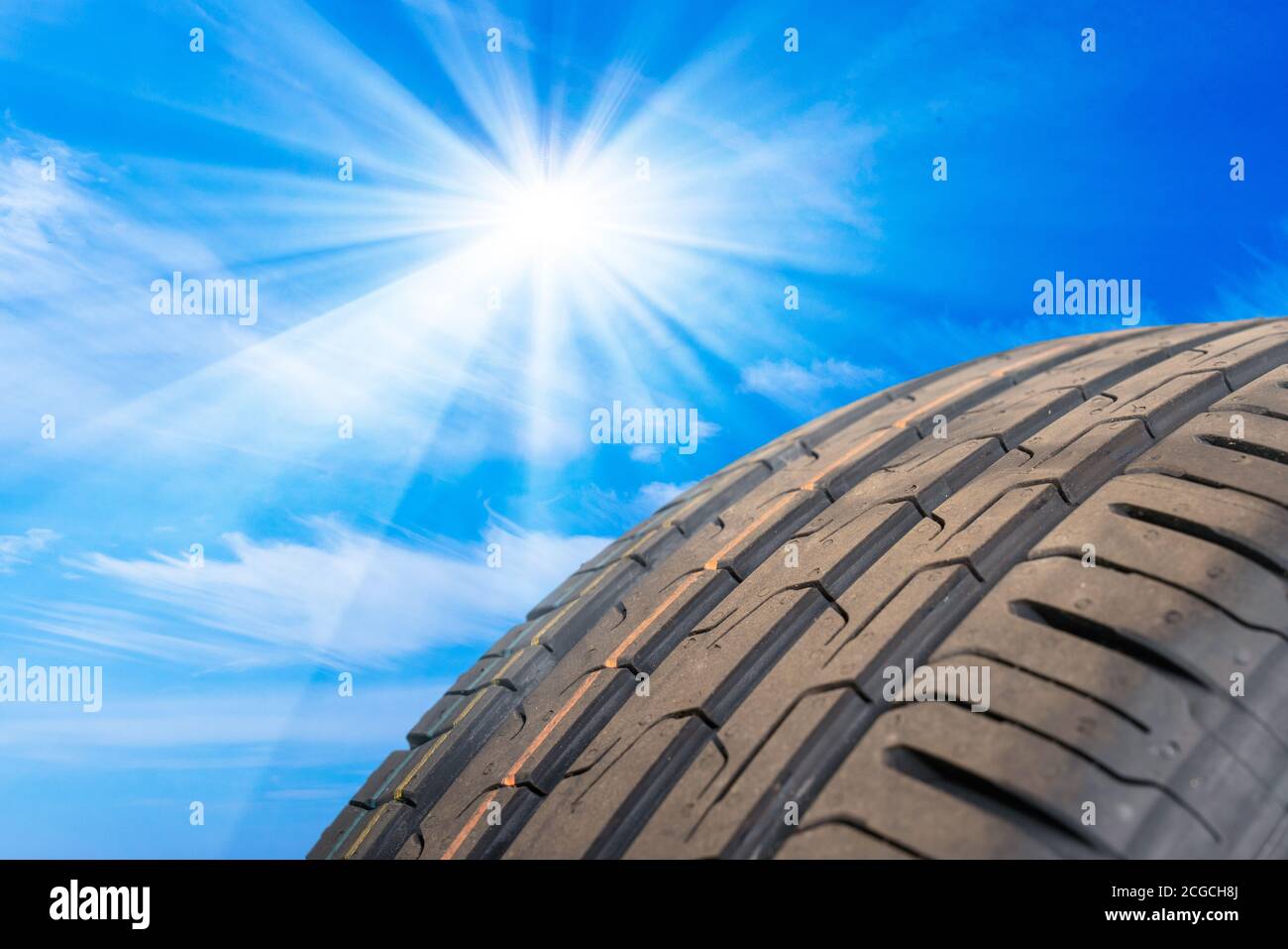 a detail photo of a car tire profile with sky in background Stock Photo ...