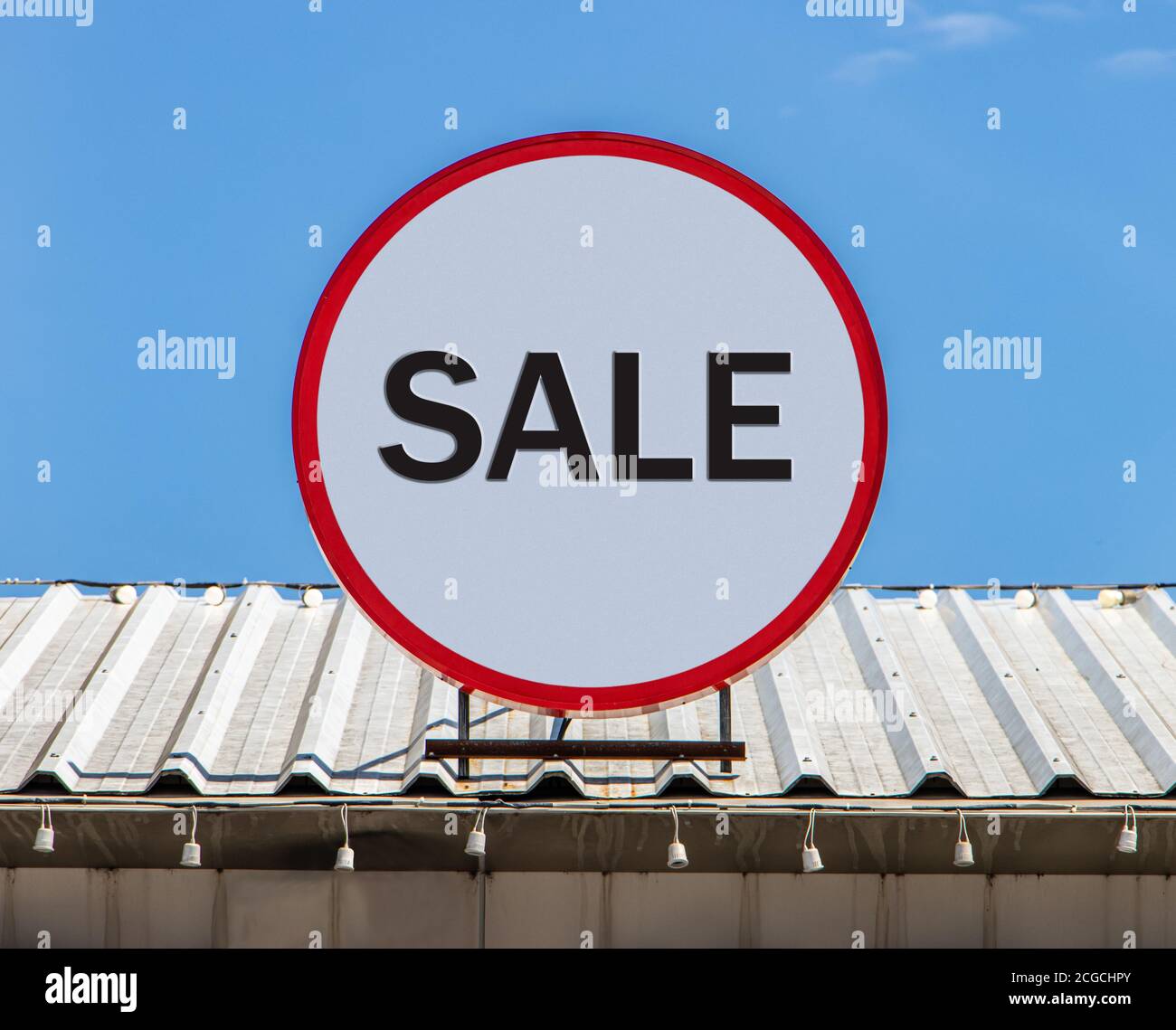 A Circle billboard with text shows SALE is installed on a roof Stock ...