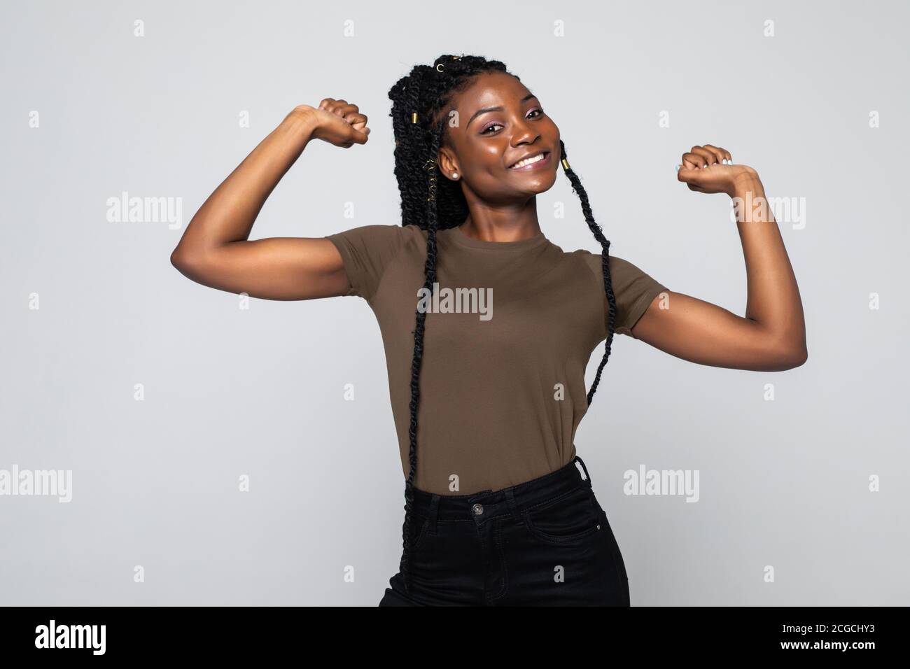 African woman winner celebrating win victory success raising hands in ...