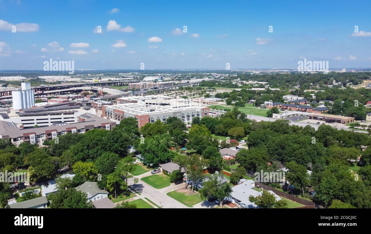 Aerial view green neighborhood with family houses next to rental ...