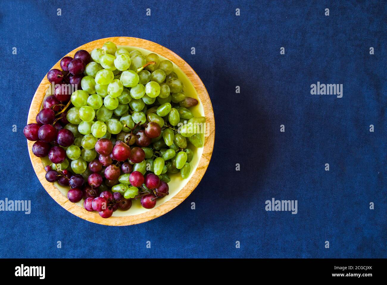 Autumn grapes on the blue background, harvesting seasonal fruit Stock ...