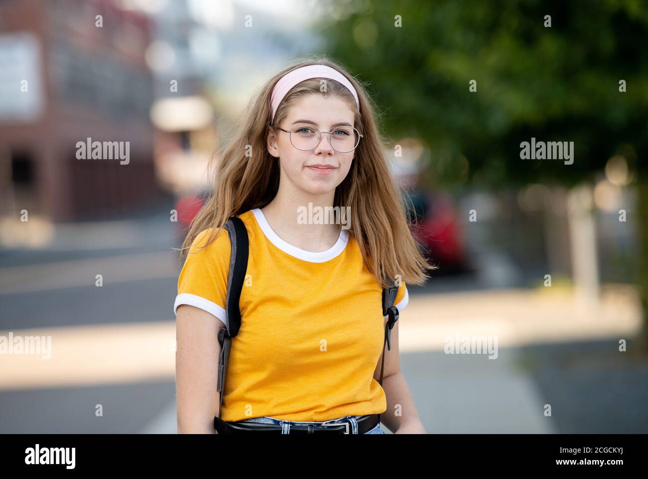 Young girl student with urban background Stock Photo - Alamy