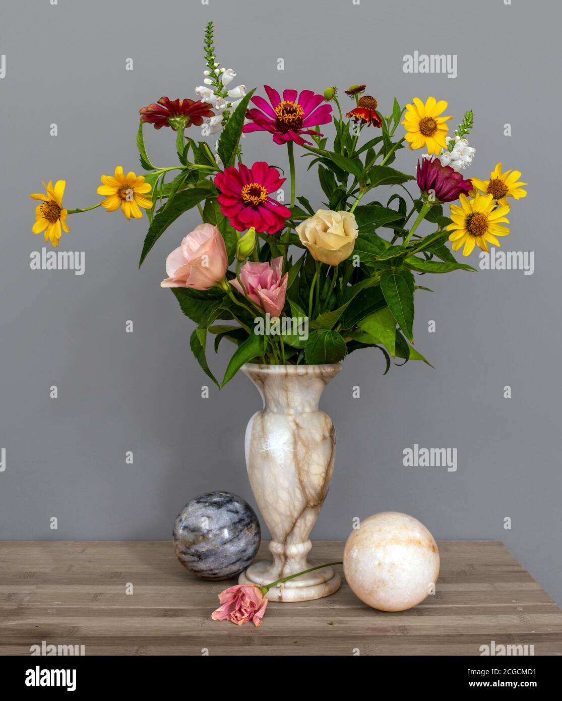 Still life with flowers balloons. A small bouquet of different flowers ...