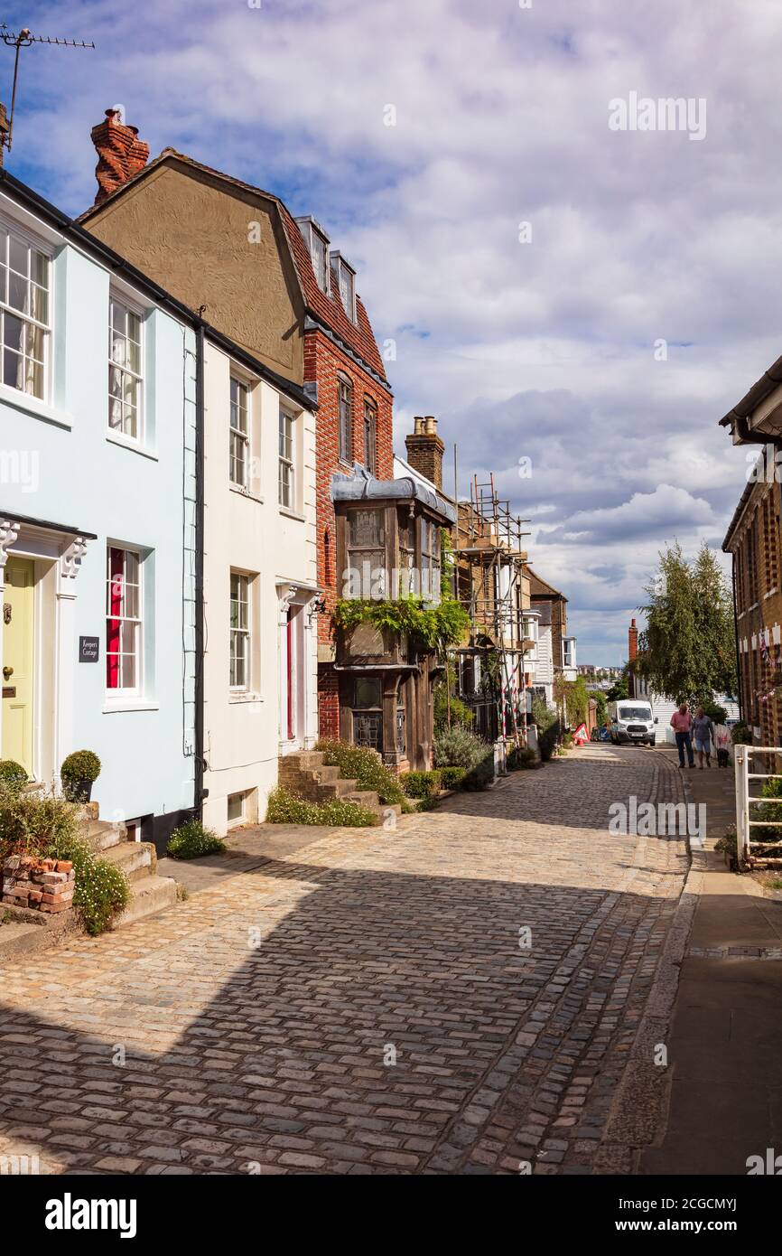 The attractive cobbled High Street in the Tiny riverside village of ...