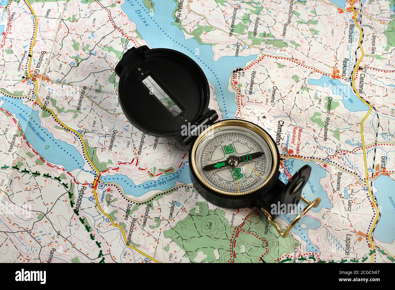 Detailed map with black compass - planning travel Stock Photo - Alamy