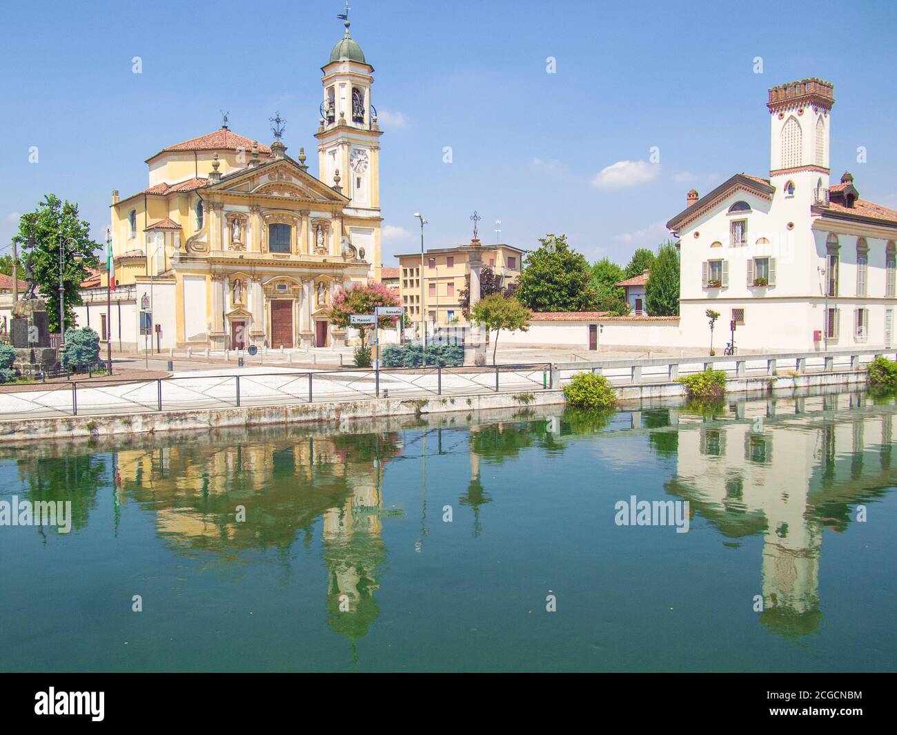 the historic center of gaggiano, in the province of Milan, reflected in ...