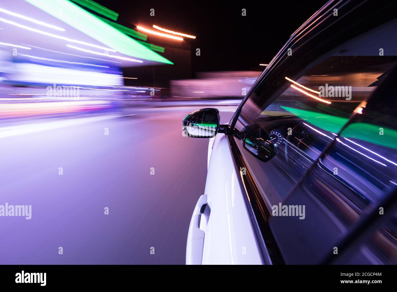 POV of car driving at night city with motion blur effect ...