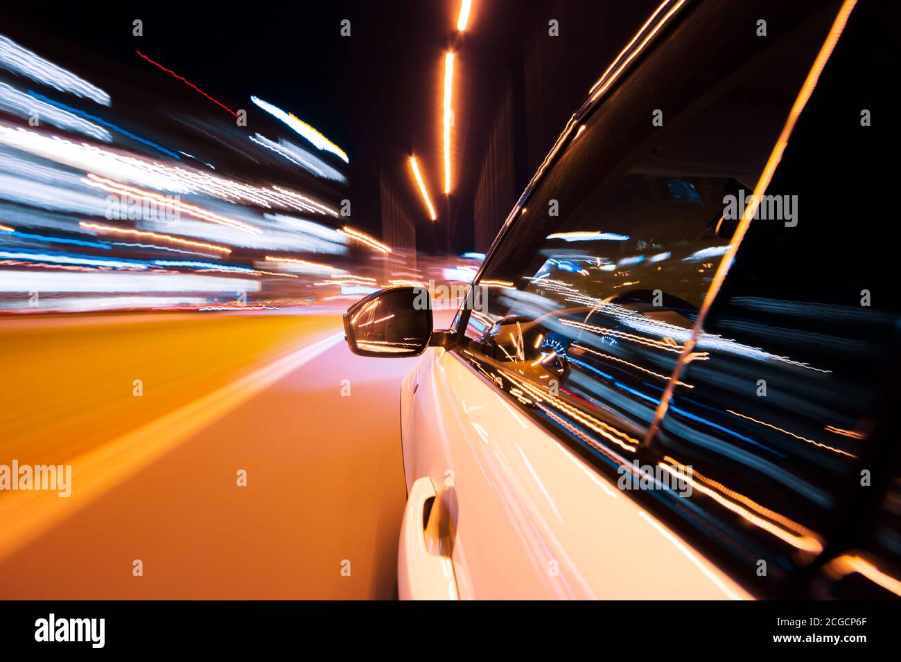 POV of car driving at night city with motion blur effect ...