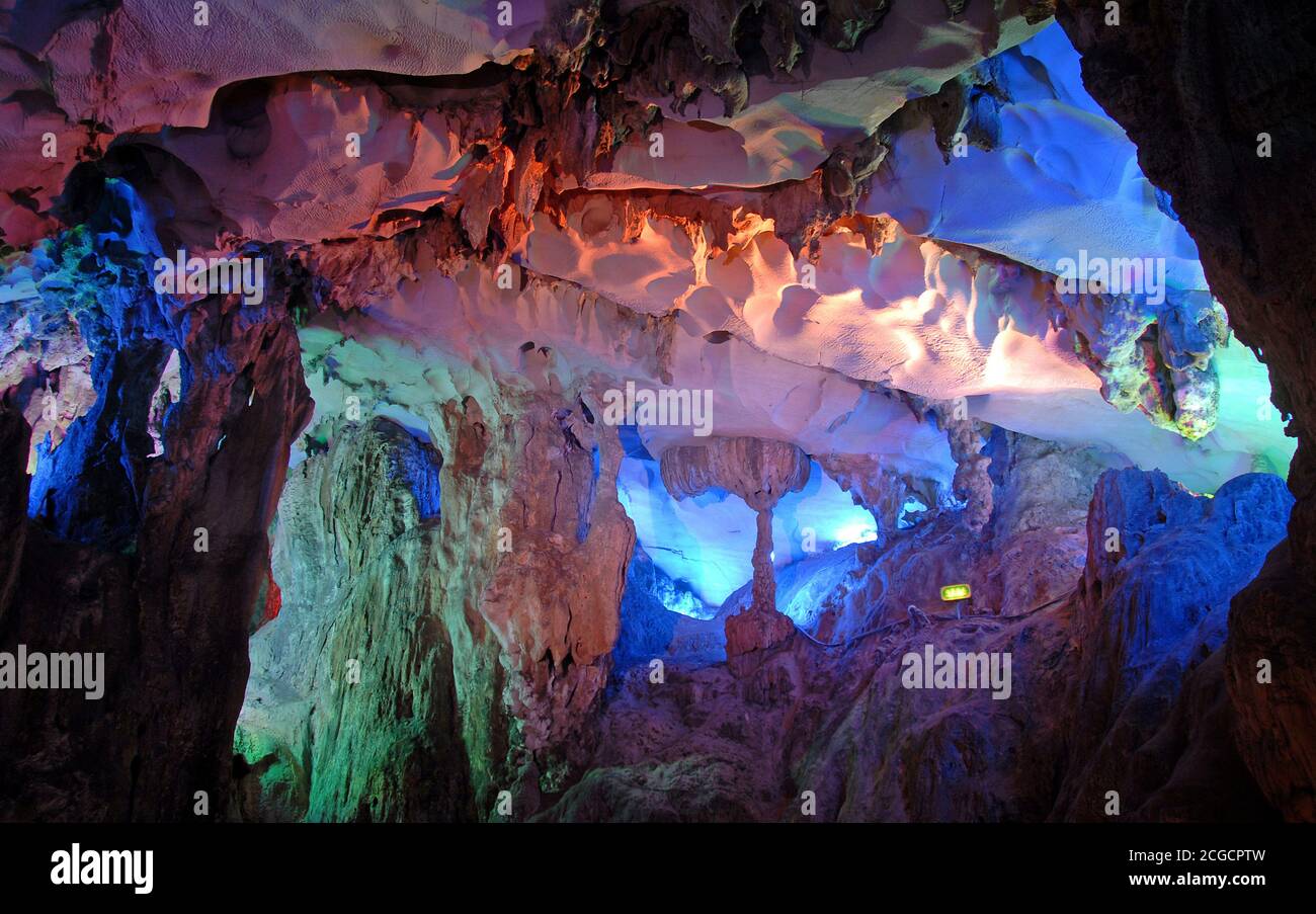 Colorful illuminated stalagmites and stalactites of Seven Star Cave in ...