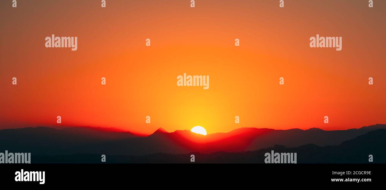 Sunshine Over Dark Silhouette Of Mountains During Sunrise. Sun Above ...