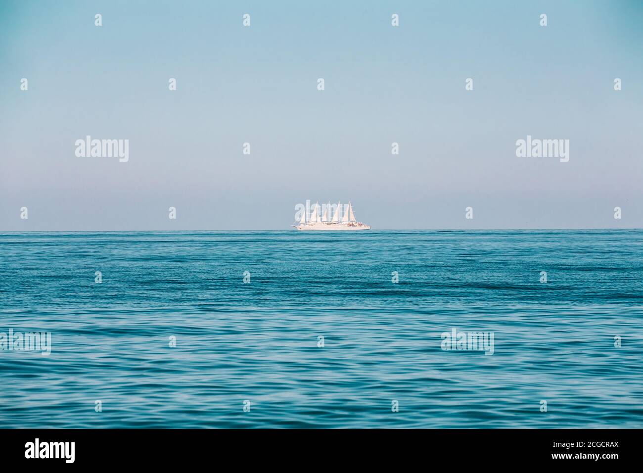 Modern Sail Ship at Sea Ocean On Horizon Stock Photo - Alamy