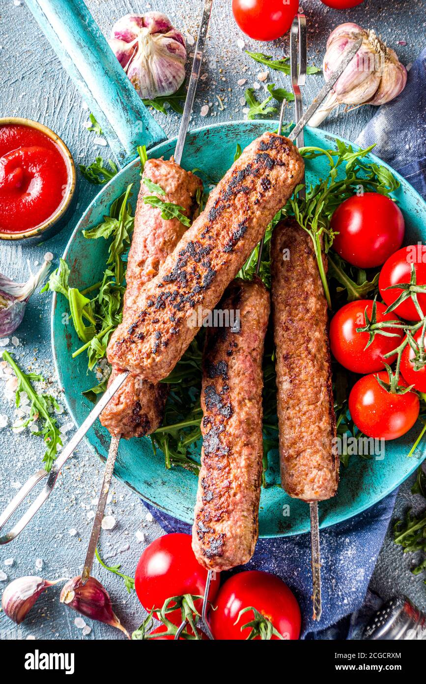 Shish kebab on skewers, from minced beef meat. Lula kebab, traditional ...