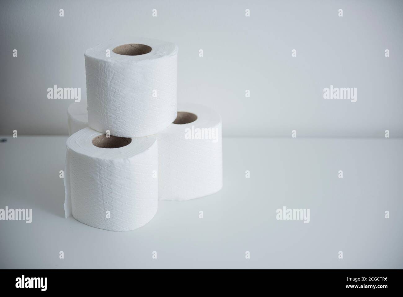Stacked rolls of toilet paper Stock Photo - Alamy