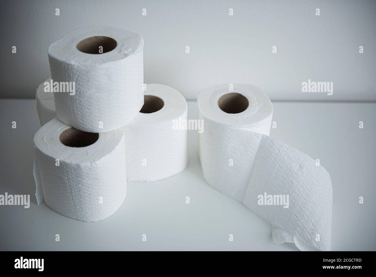 Stacked rolls of toilet paper Stock Photo - Alamy
