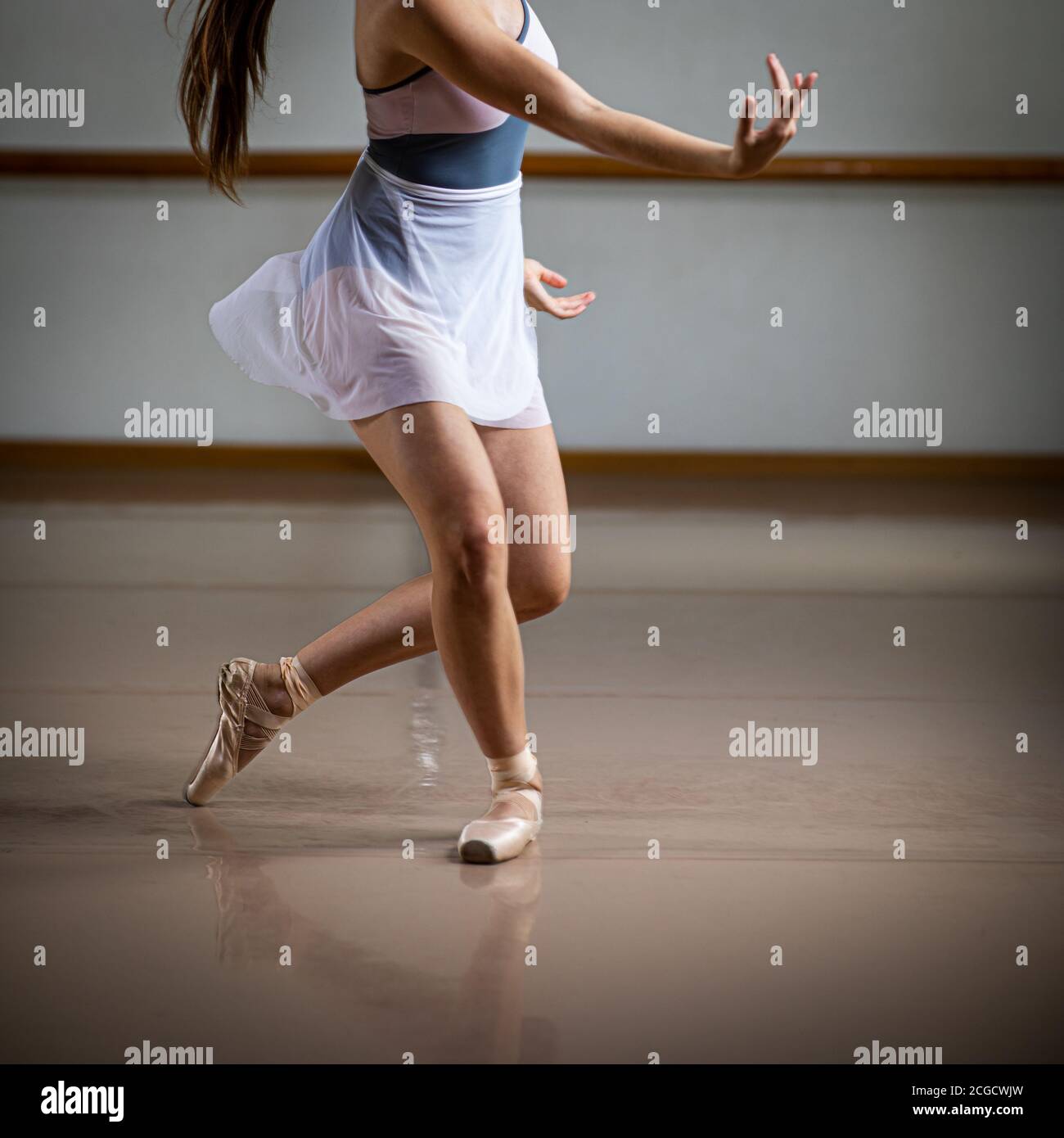 Legs and slippers of classical ballet dancers rehearsing Stock Photo ...