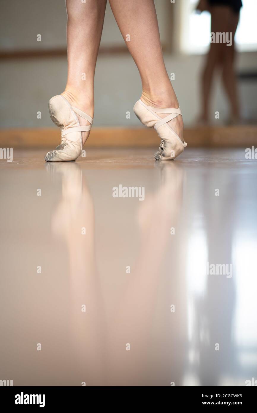 Legs and slippers of classical ballet dancers rehearsing Stock Photo ...