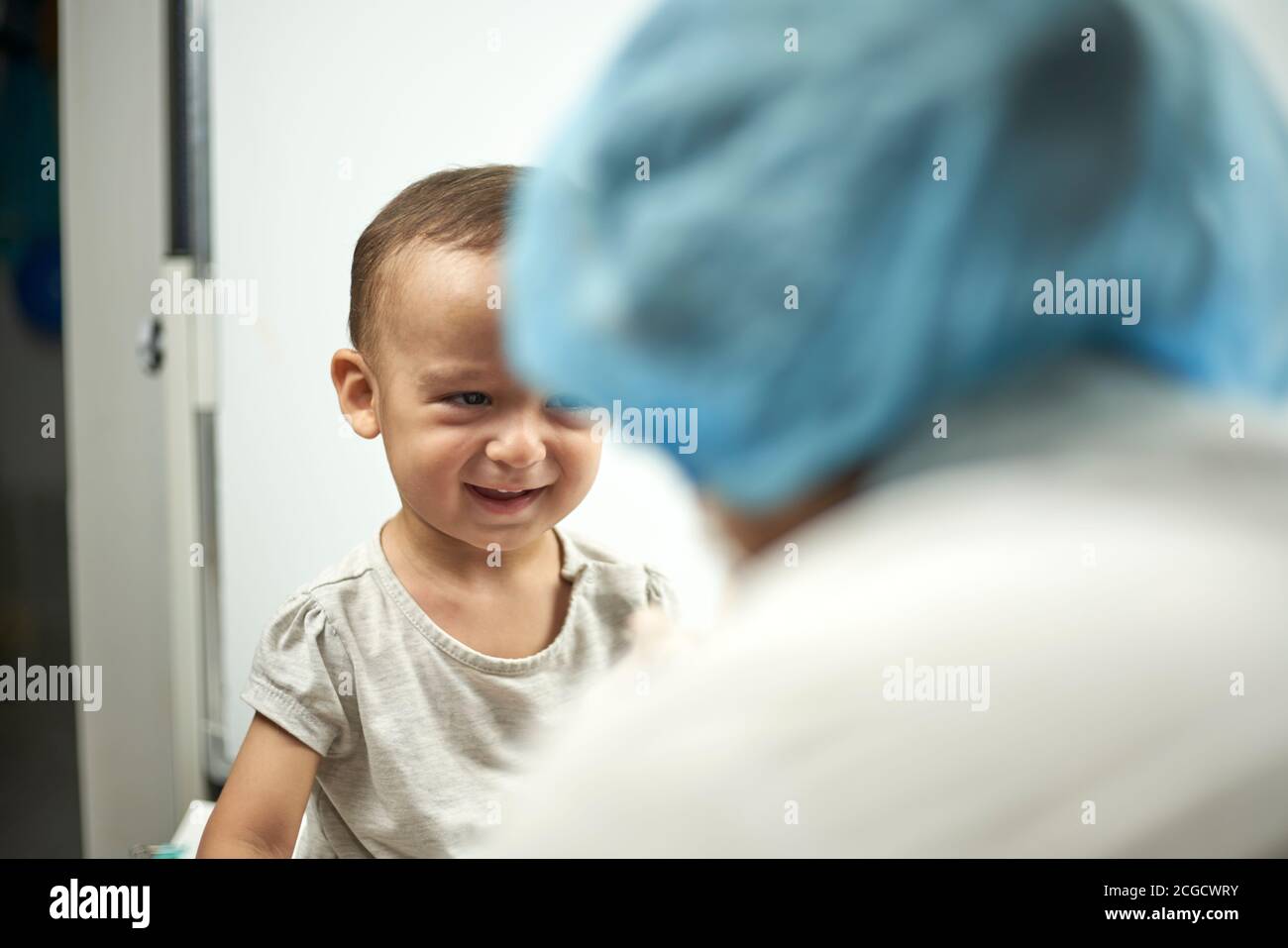 Pediatrician checking baby teeth. Dentist examines teeth of baby boy ...