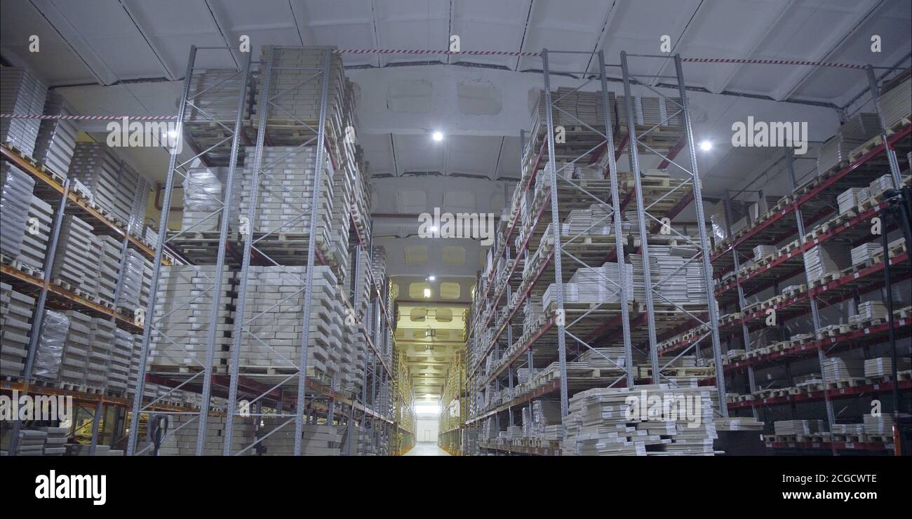 A large warehouse with products from the DCS. Large storage shelves ...