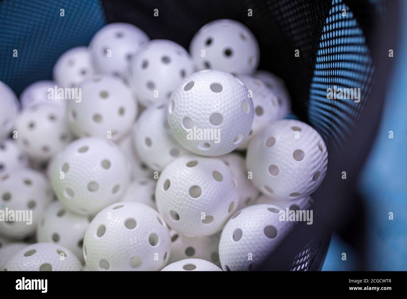Floorball balls in a basket ready for training Stock Photo - Alamy
