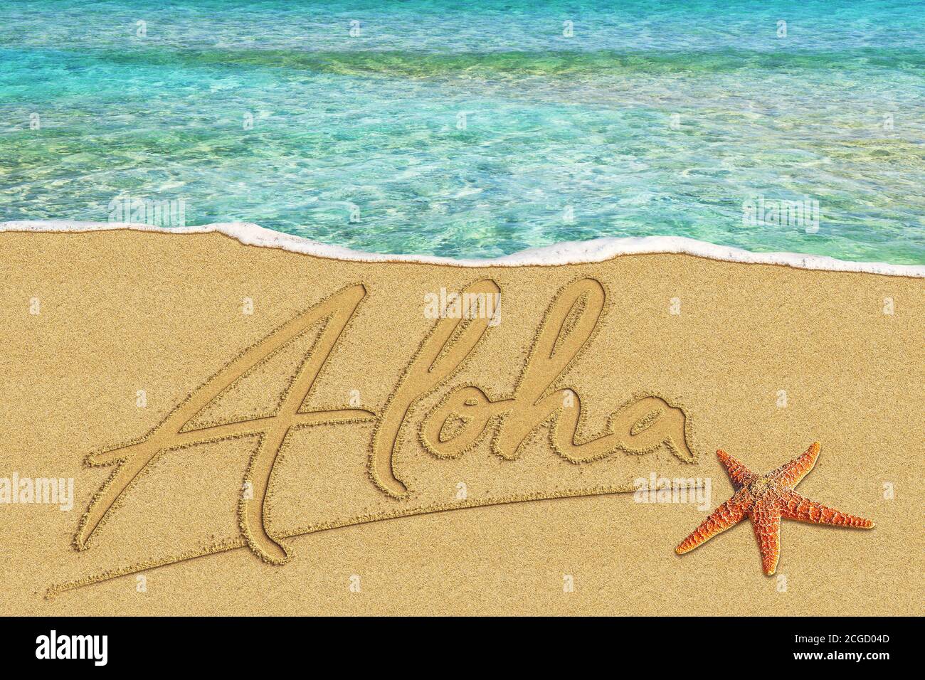 Aloha written in the sand on the beach Stock Photo - Alamy