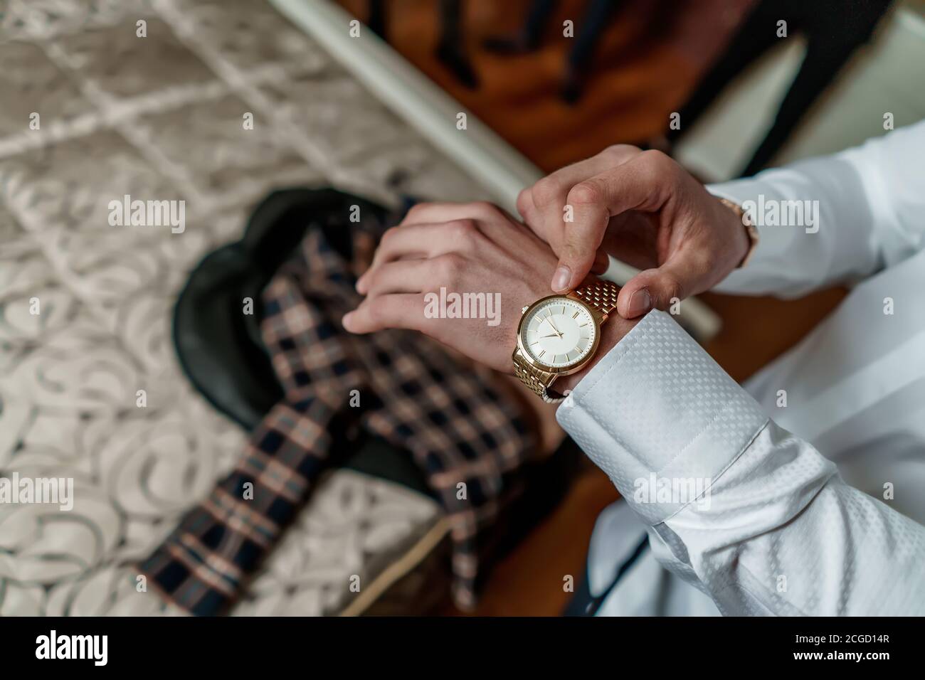 Businessman man puts on suit hi-res stock photography and images - Alamy