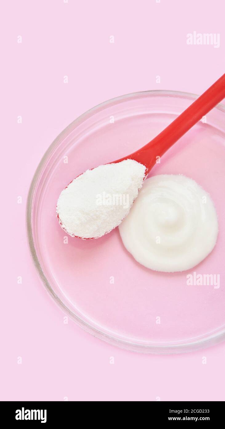 Collagen white powder. Pastel color background. Health product Stock ...