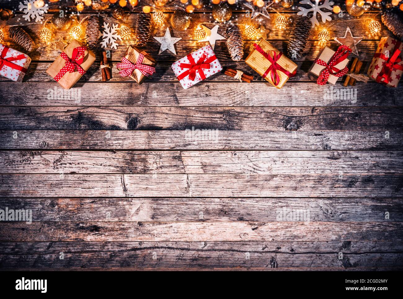 Decorative Christmas rustic background with gift boxes on wooden planks ...