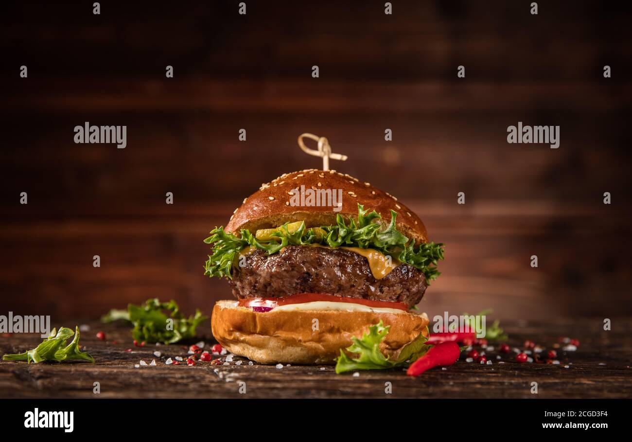 Delicious hamburger, served on wood. Free space for text Stock Photo ...