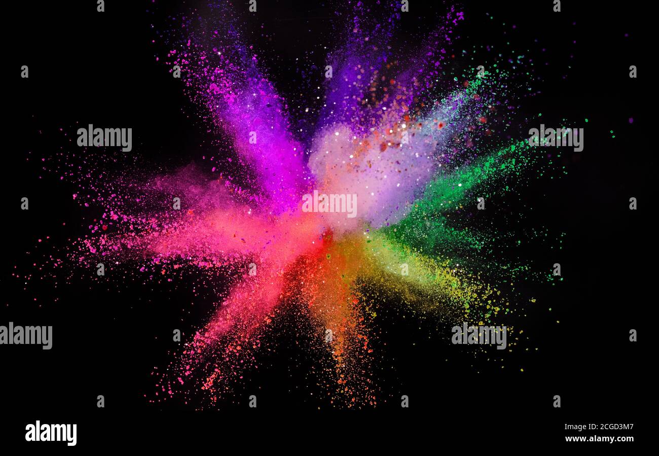 Colored powder explosion isolated on black background Stock Photo - Alamy