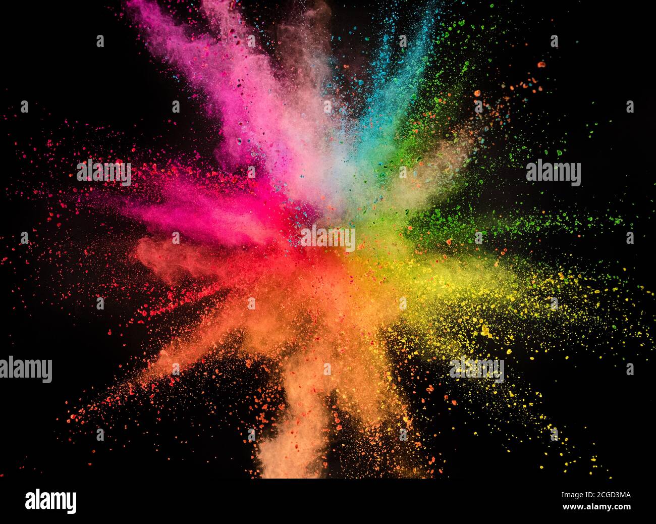 Colored powder explosion isolated on black background Stock Photo - Alamy