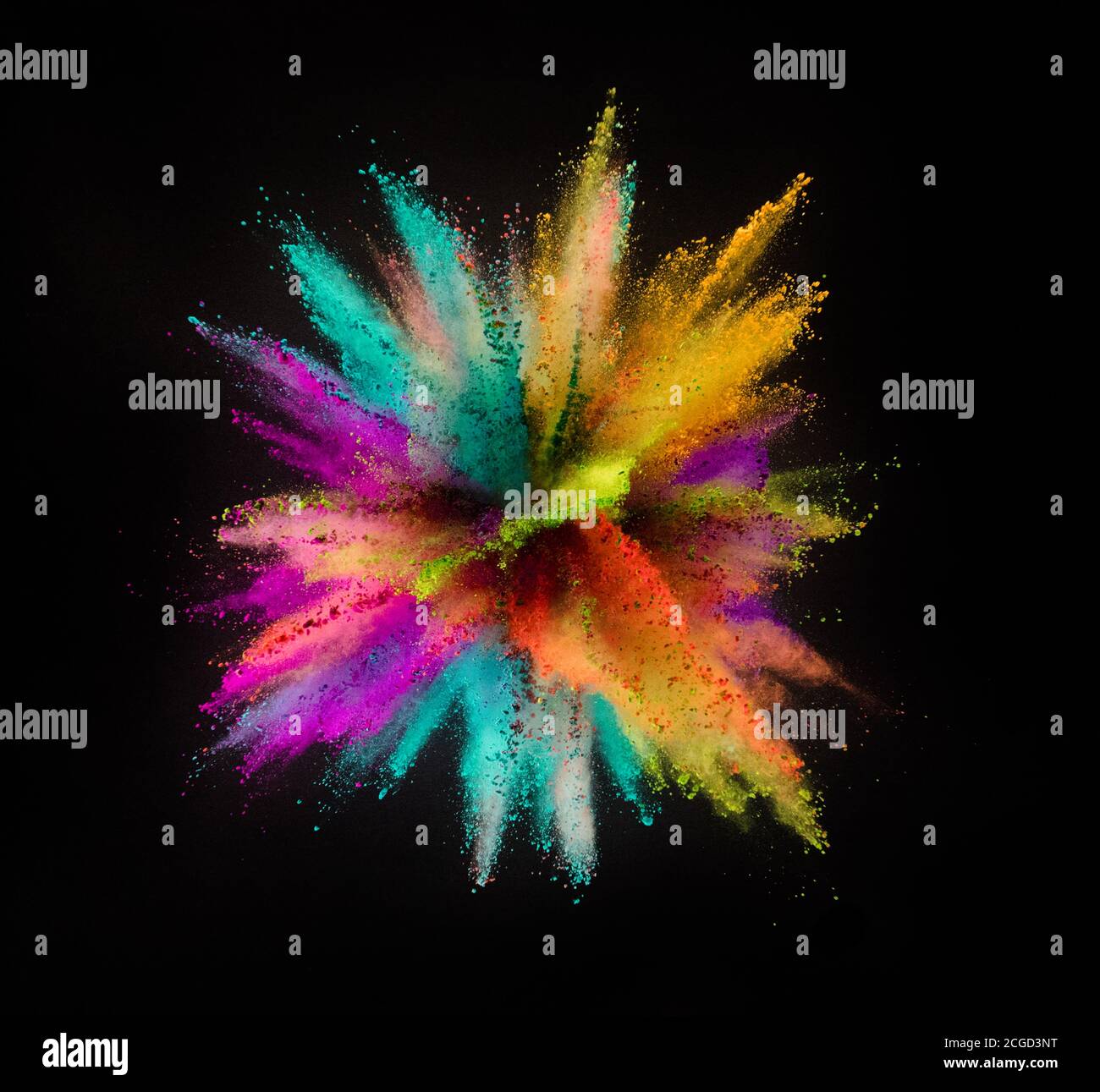 Colored powder explosion isolated on black background Stock Photo - Alamy
