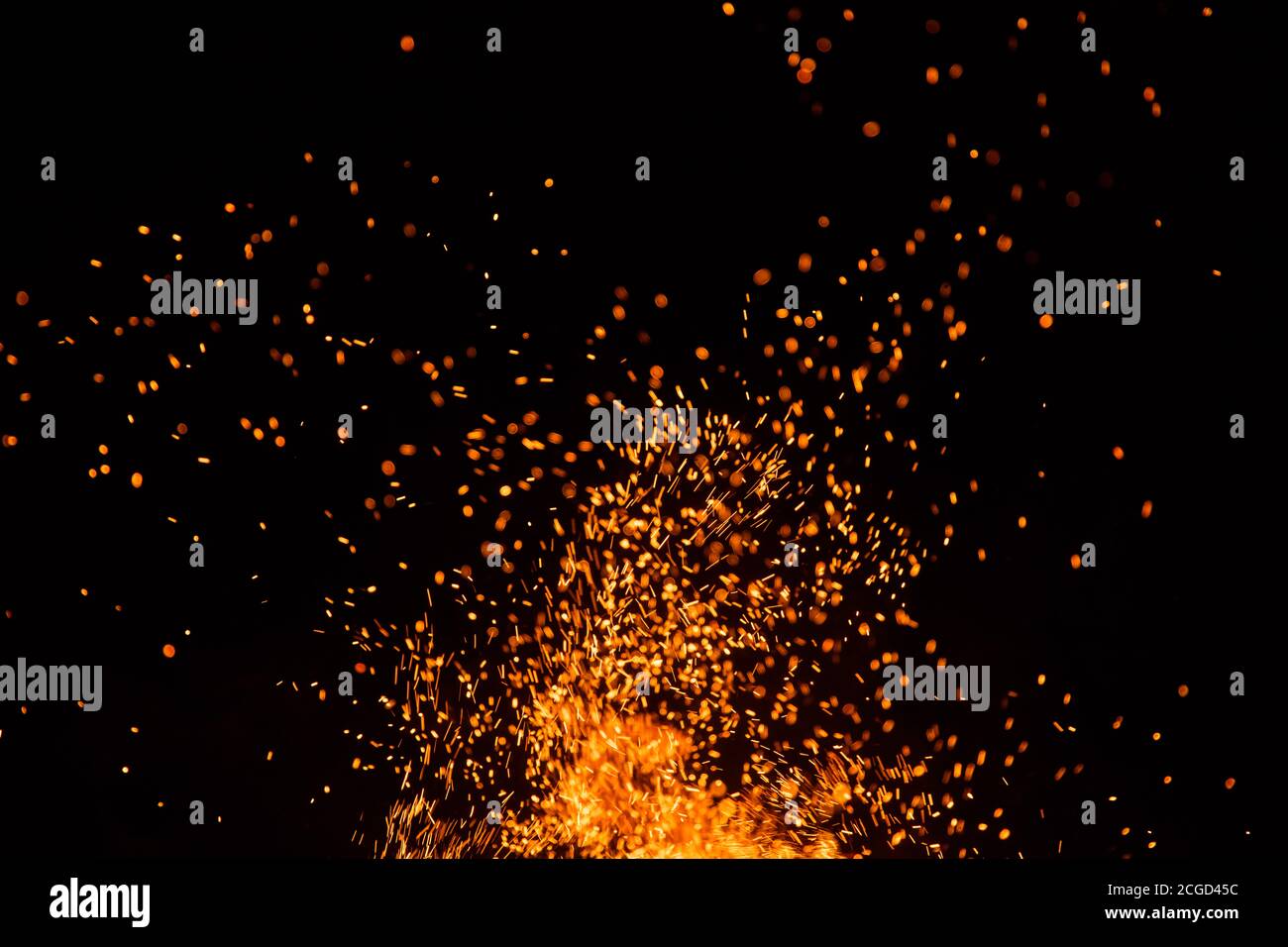Fire sparks particles with flames isolated on black background. Very ...