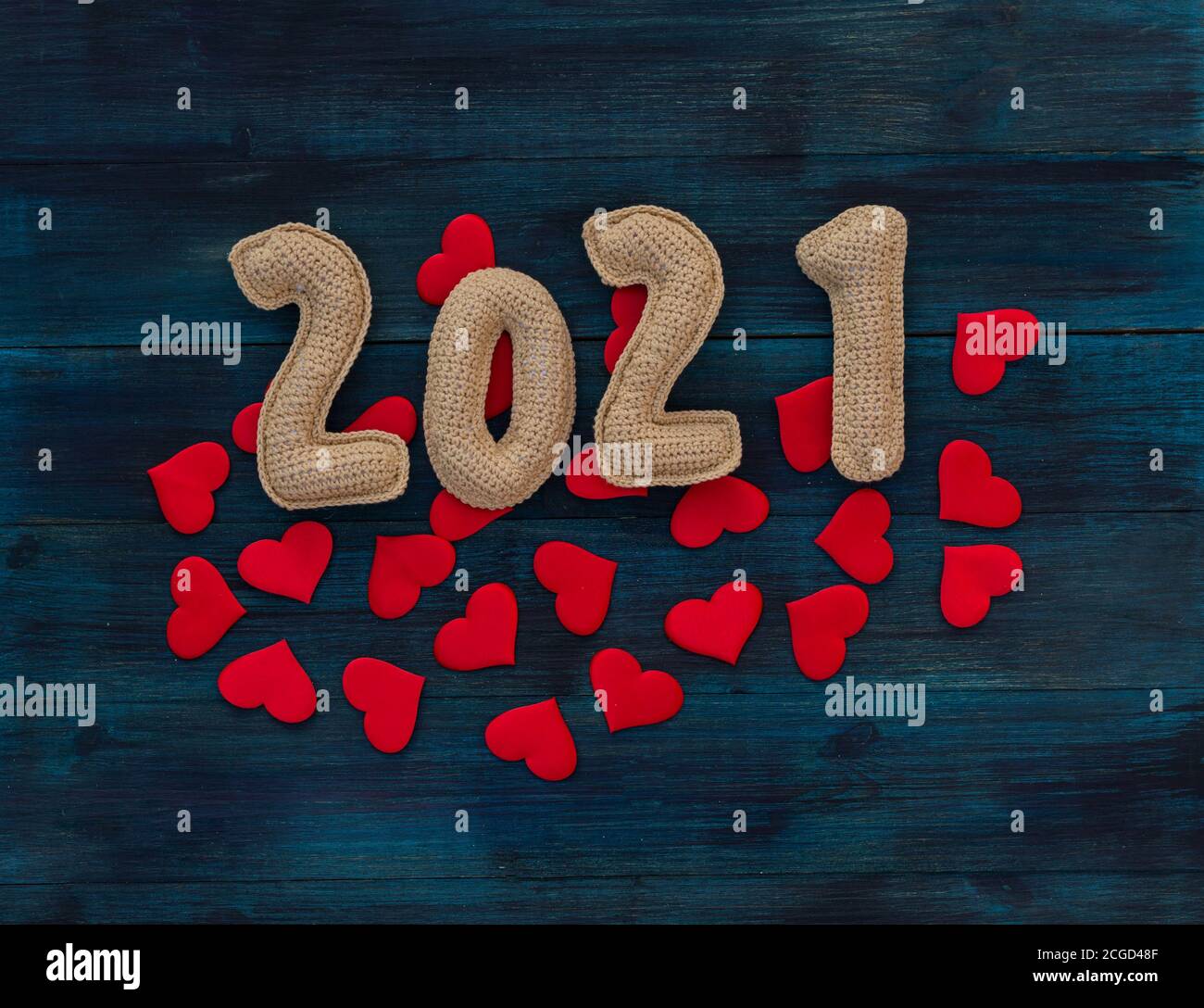 Romantic christmas background with knitted number 21 and red hearts ...