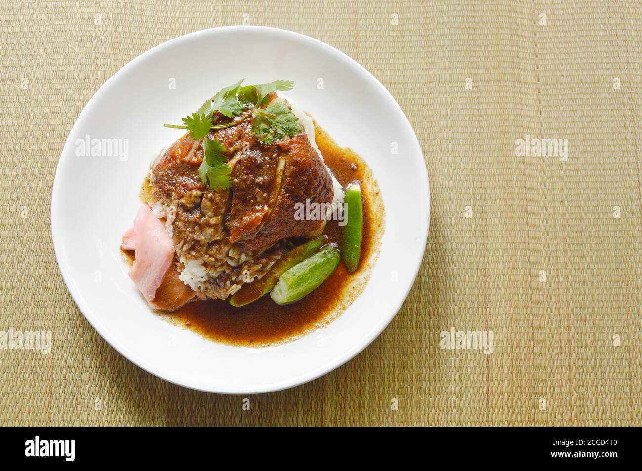 roasted duck meat topping rice dressing sweet sauce and pickled ginger ...