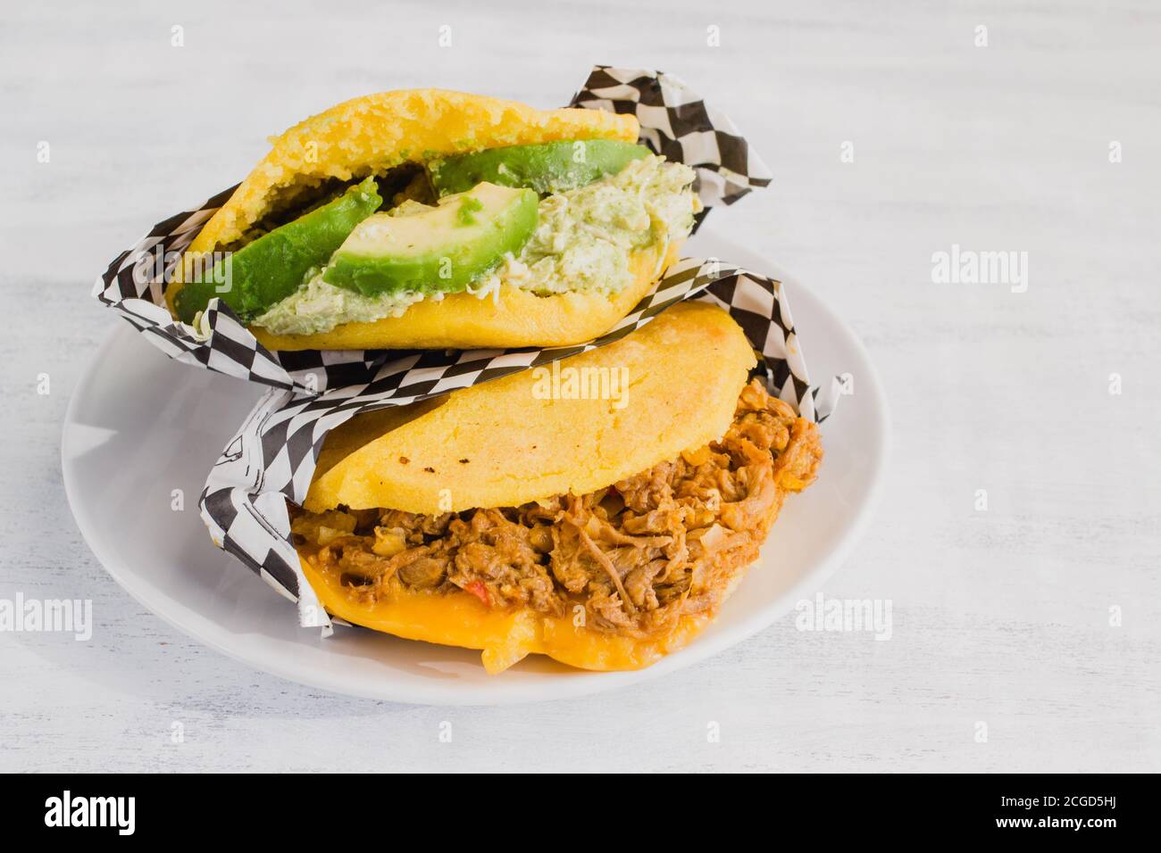 Arepa on a white background, side view Stock Photo - Alamy
