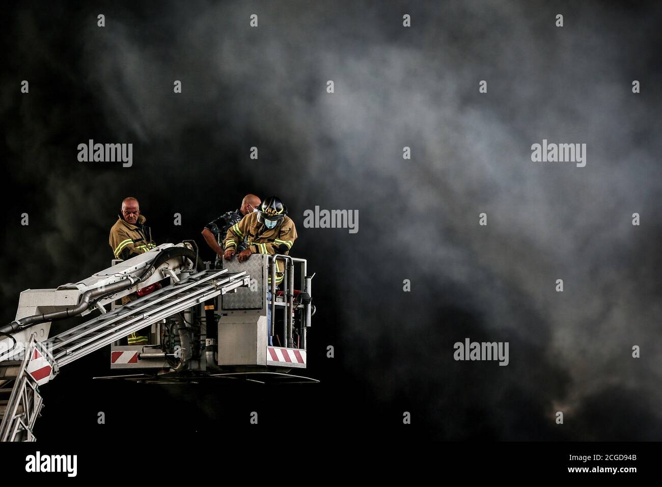 Beirut, Lebanon. 10th Sep, 2020. Firefighters try to douse flames ...