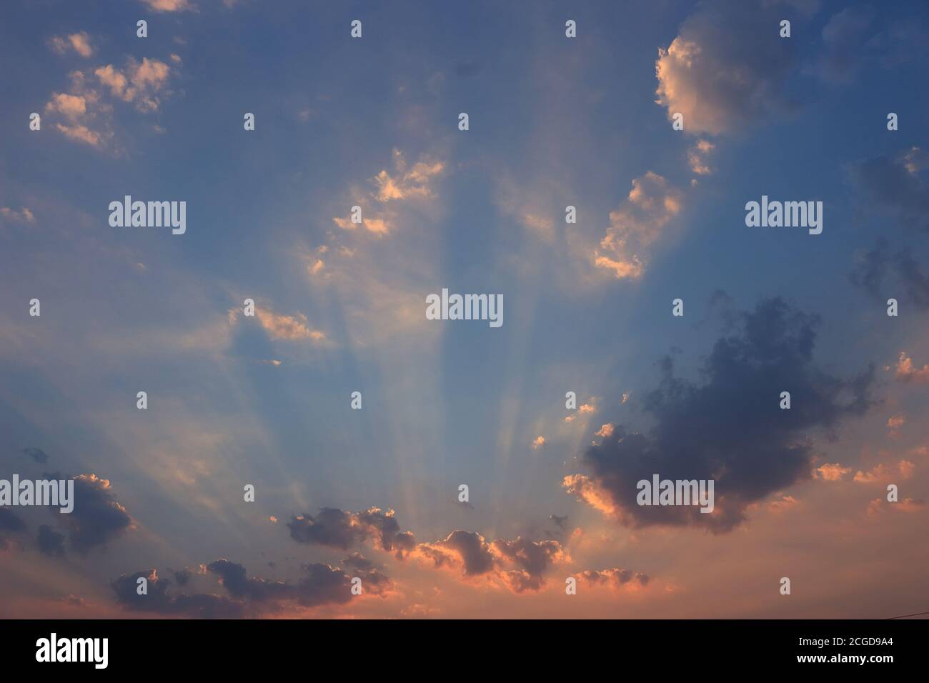 Evening sky. See the sun's rays shining through the clouds and the sky ...
