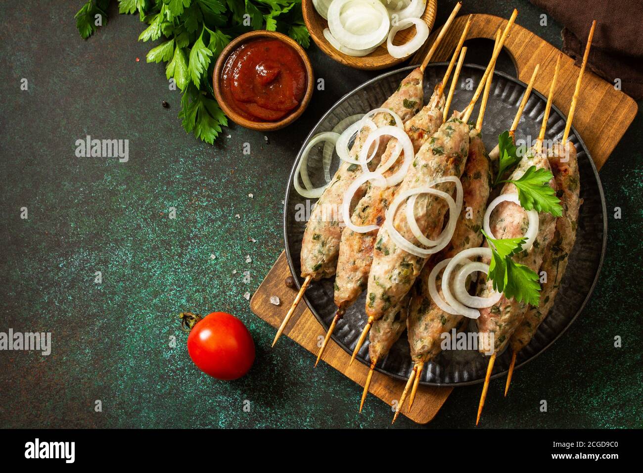 Turkish kebab. Homemade Kofta kebabs on a skewer with vegetables and ...